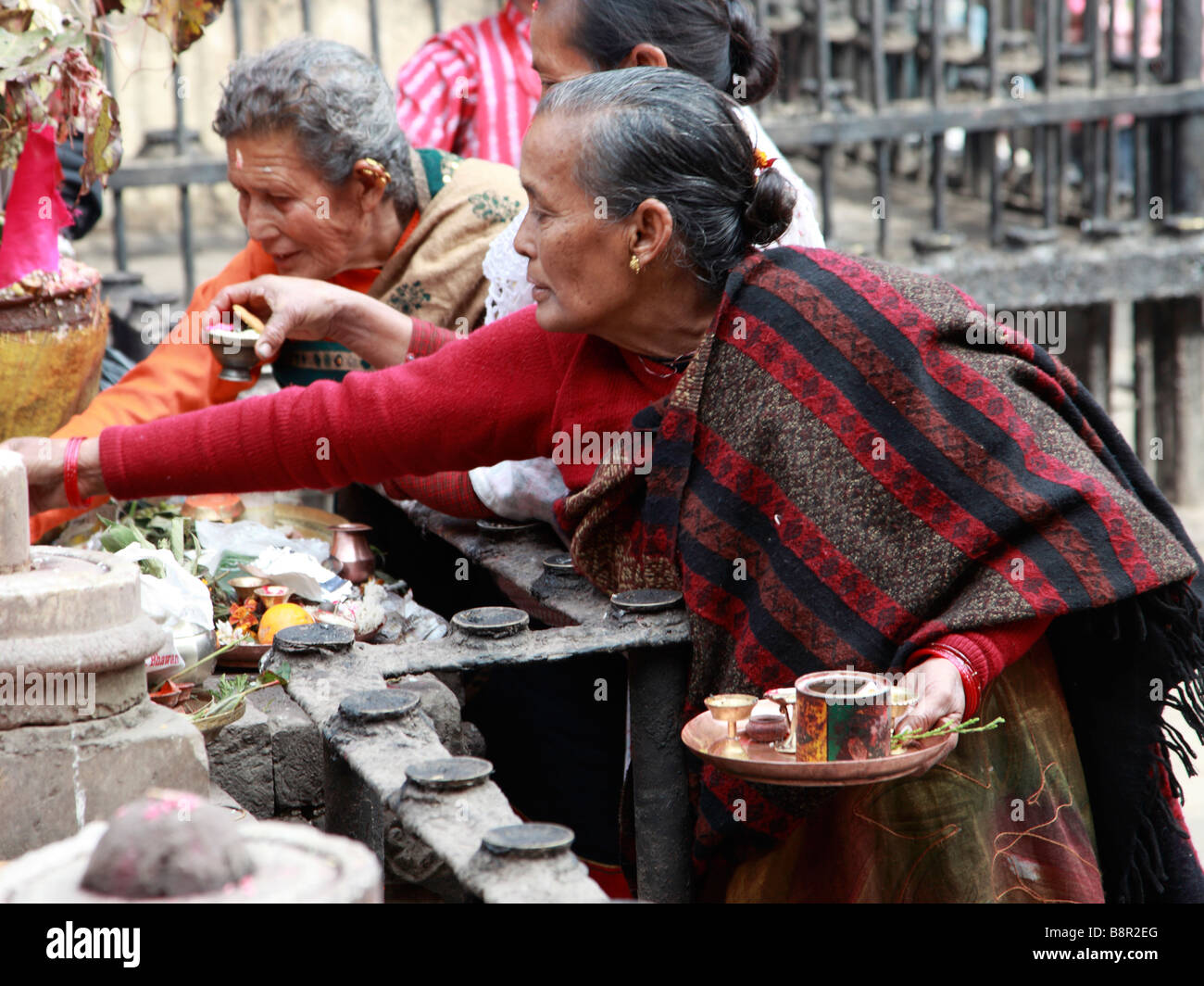 Nepal Kathmandu Valley Bhaktapur women making religious ritual ...