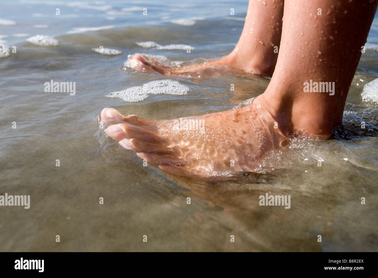 Getting beach sand off feet hi-res stock photography and images - Alamy