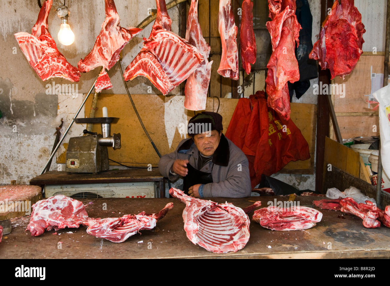 A local Chinese butcher in one of Nanjing's old markets Stock Photo - Alamy