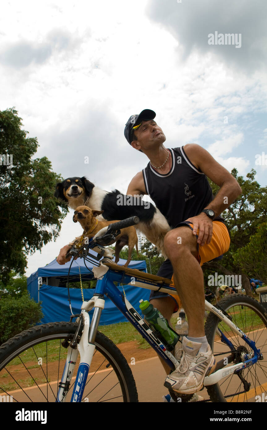 Taking his pets for a ride in Brasilia's main park Stock Photo - Alamy