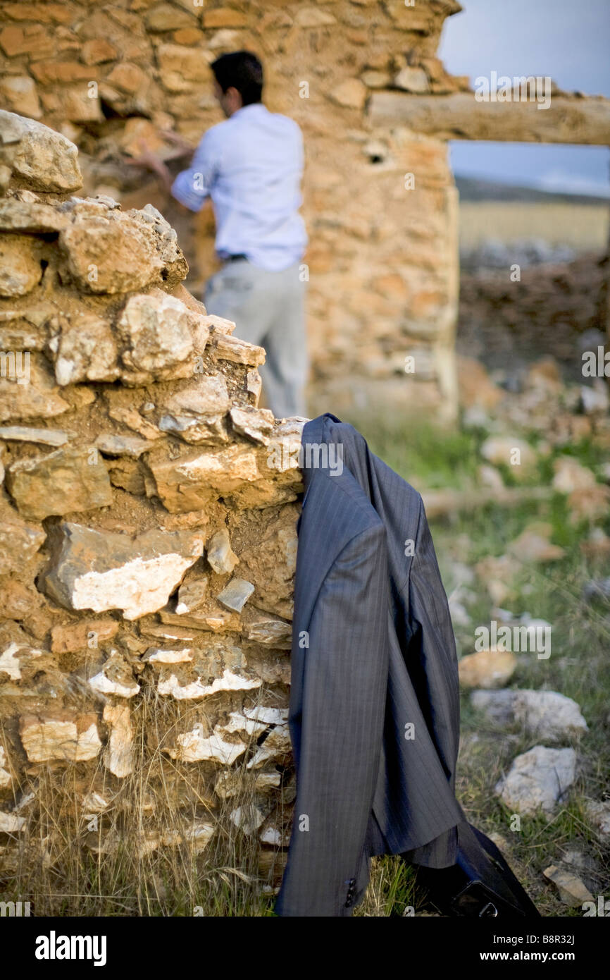 Business man rebuilding his ruined house Stock Photo - Alamy