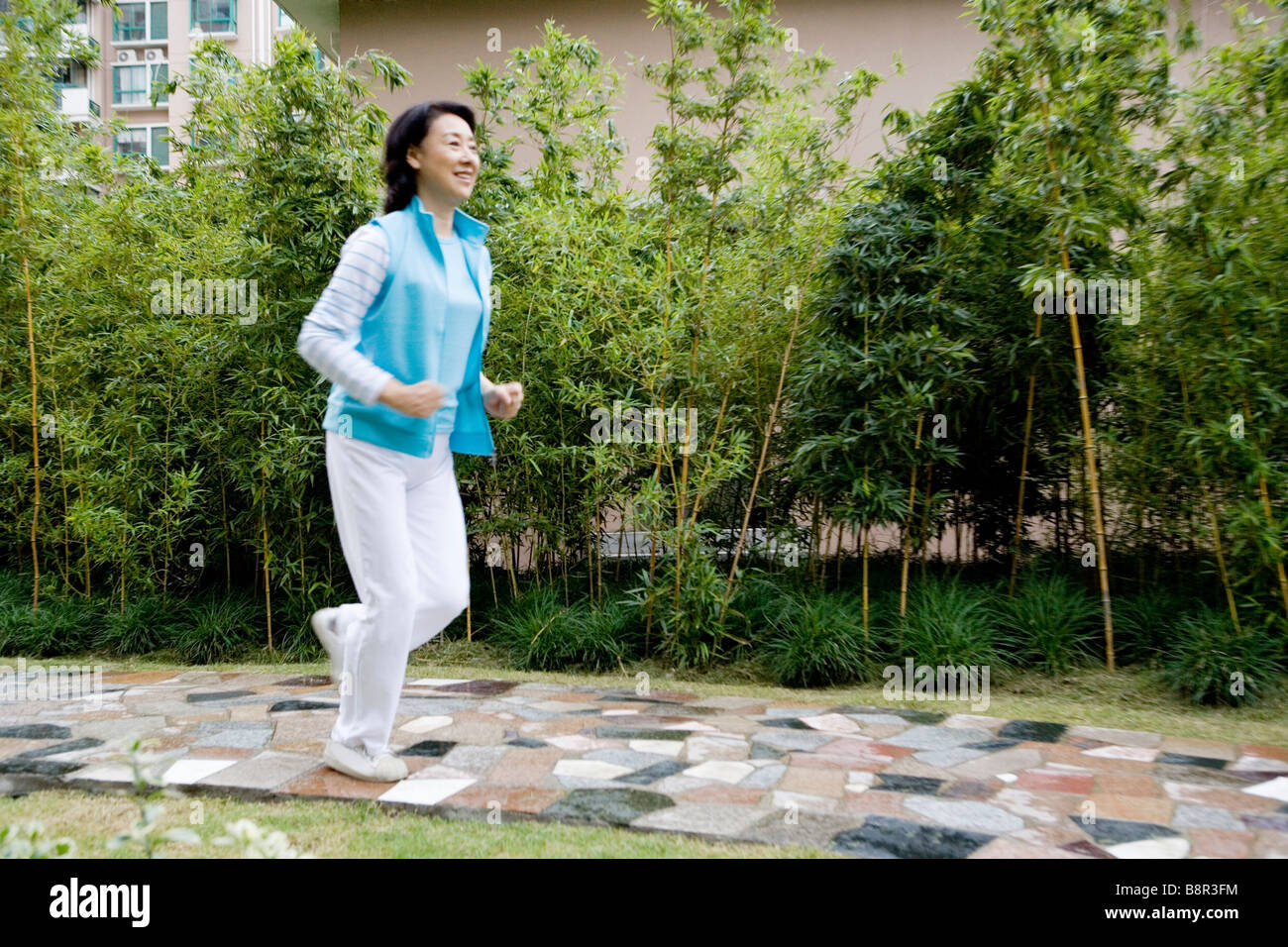 Senior woman jogging outdoors Stock Photo - Alamy