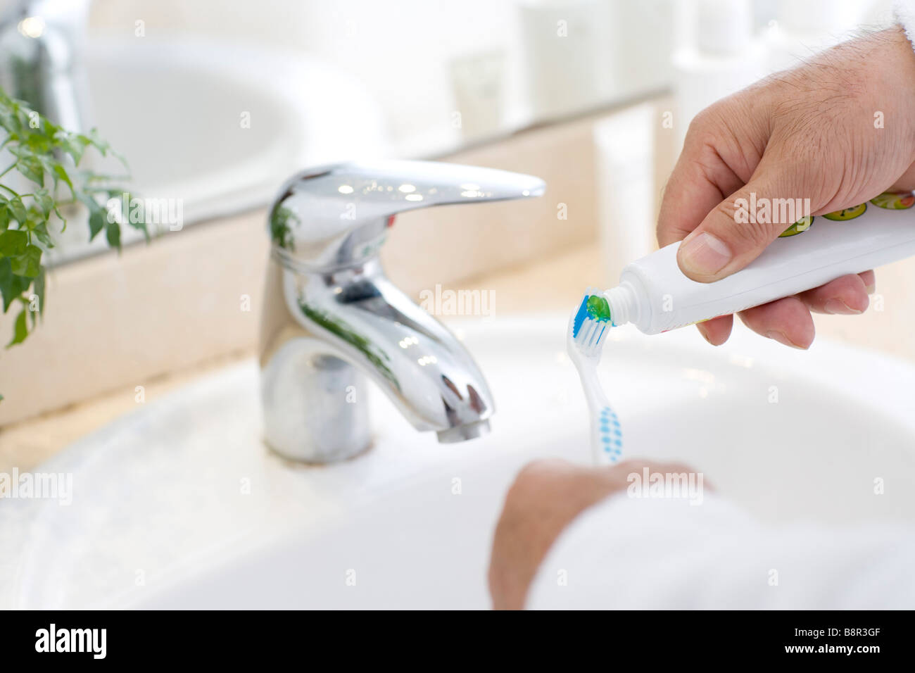 Squeezing Toothpaste Onto Toothbrush High Resolution Stock Photography ...