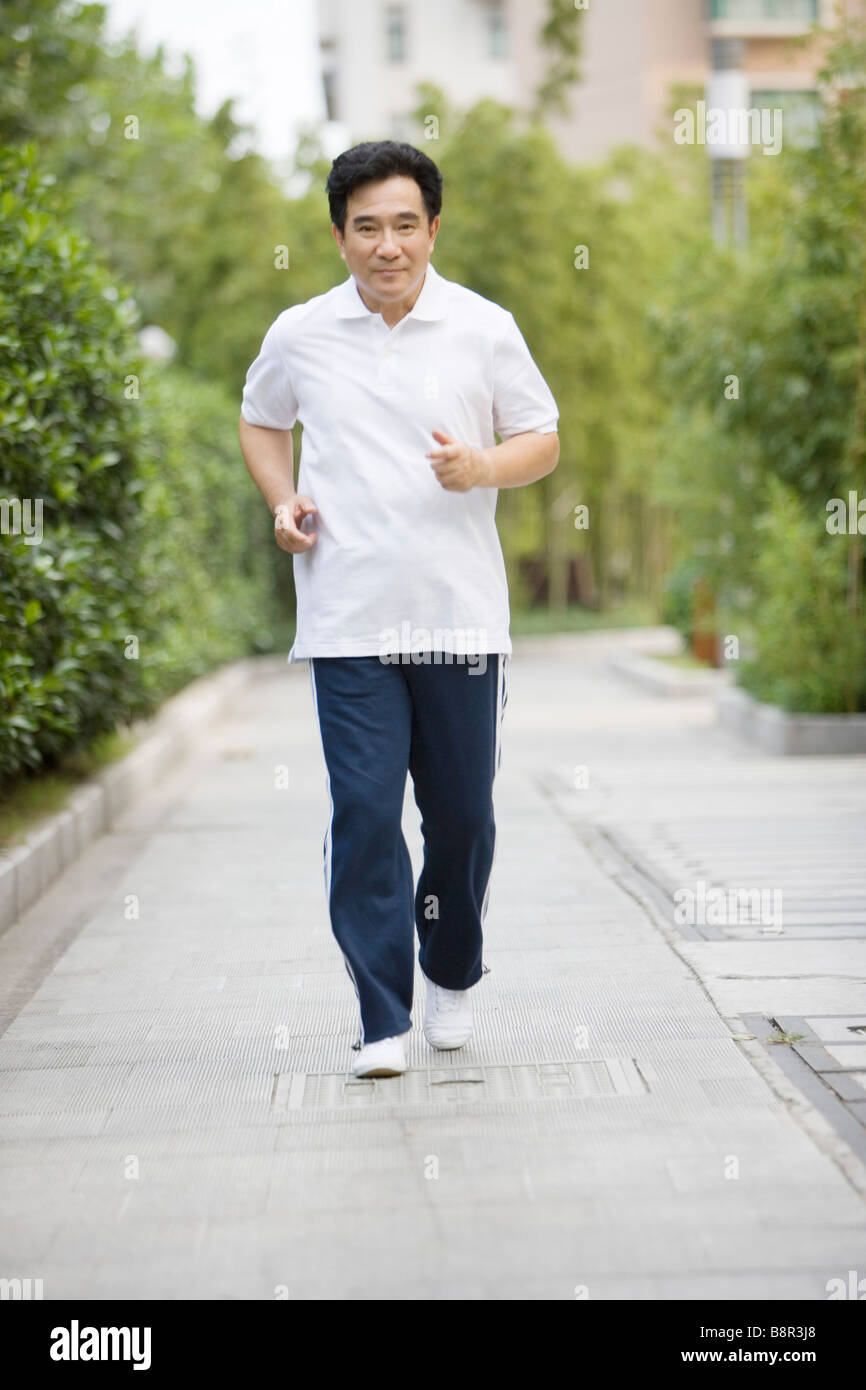 Senior chinese man jogging in hi-res stock photography and images - Alamy