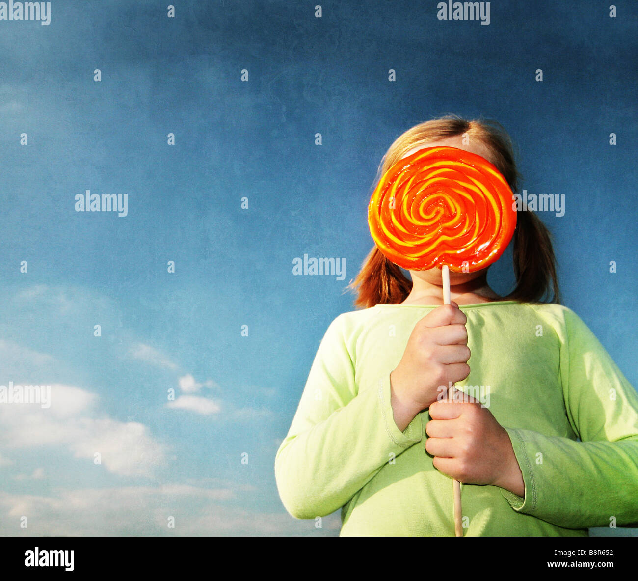 Girl hiding candy hi-res stock photography and images - Alamy