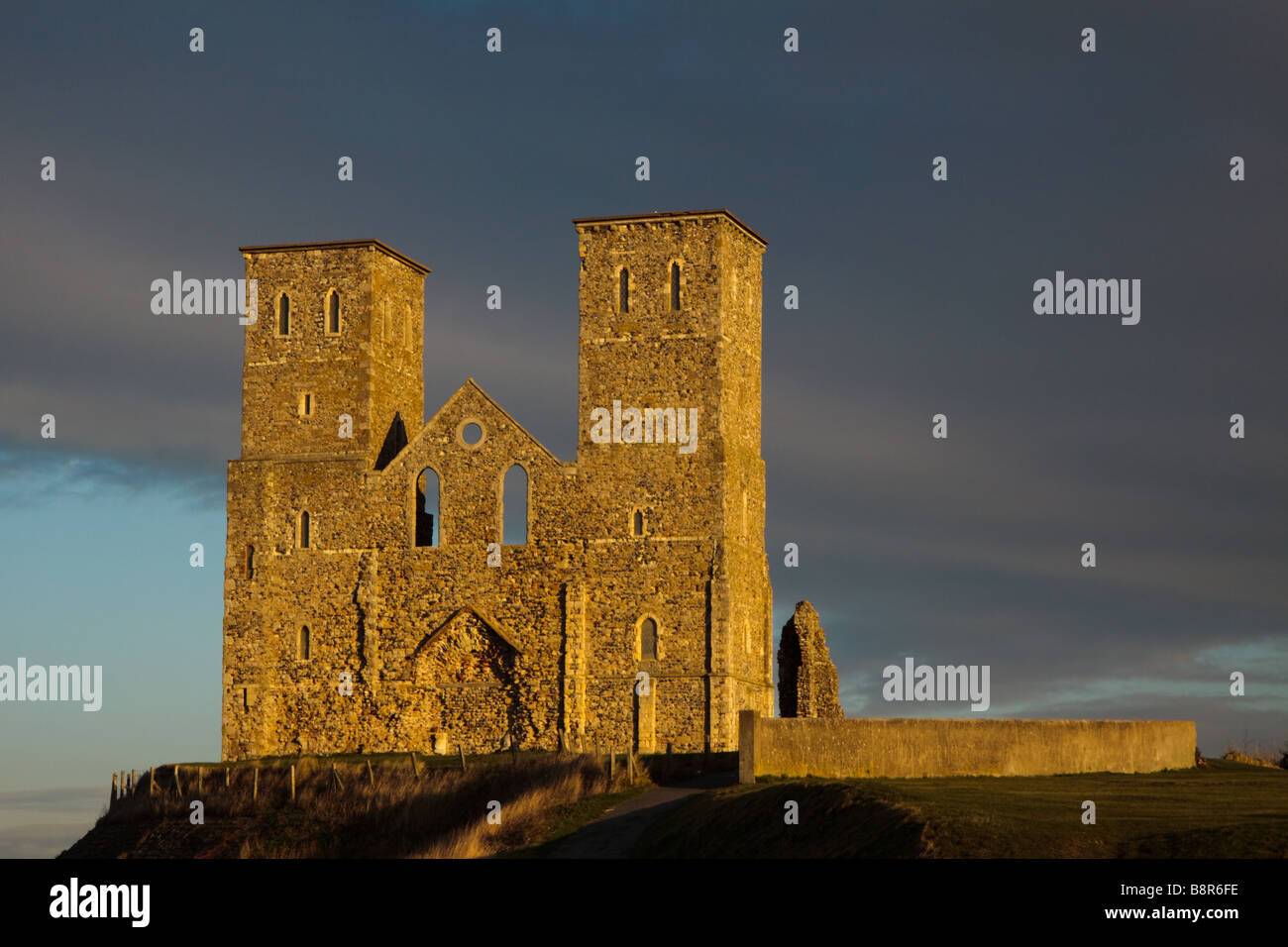 Remains of Reculver church towers bathed in late afternoon sun in ...