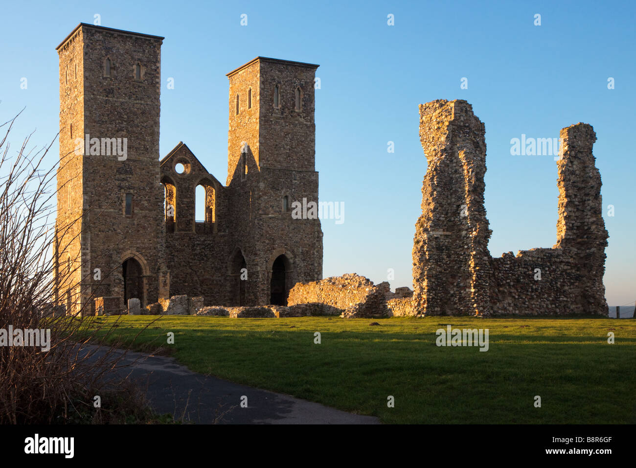 Remains of Reculver church towers bathed in late afternoon sun in ...