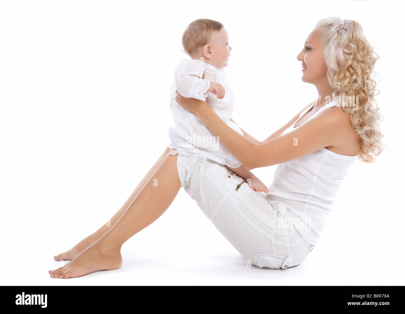Smiling women with her little child isolated on white Stock Photo - Alamy