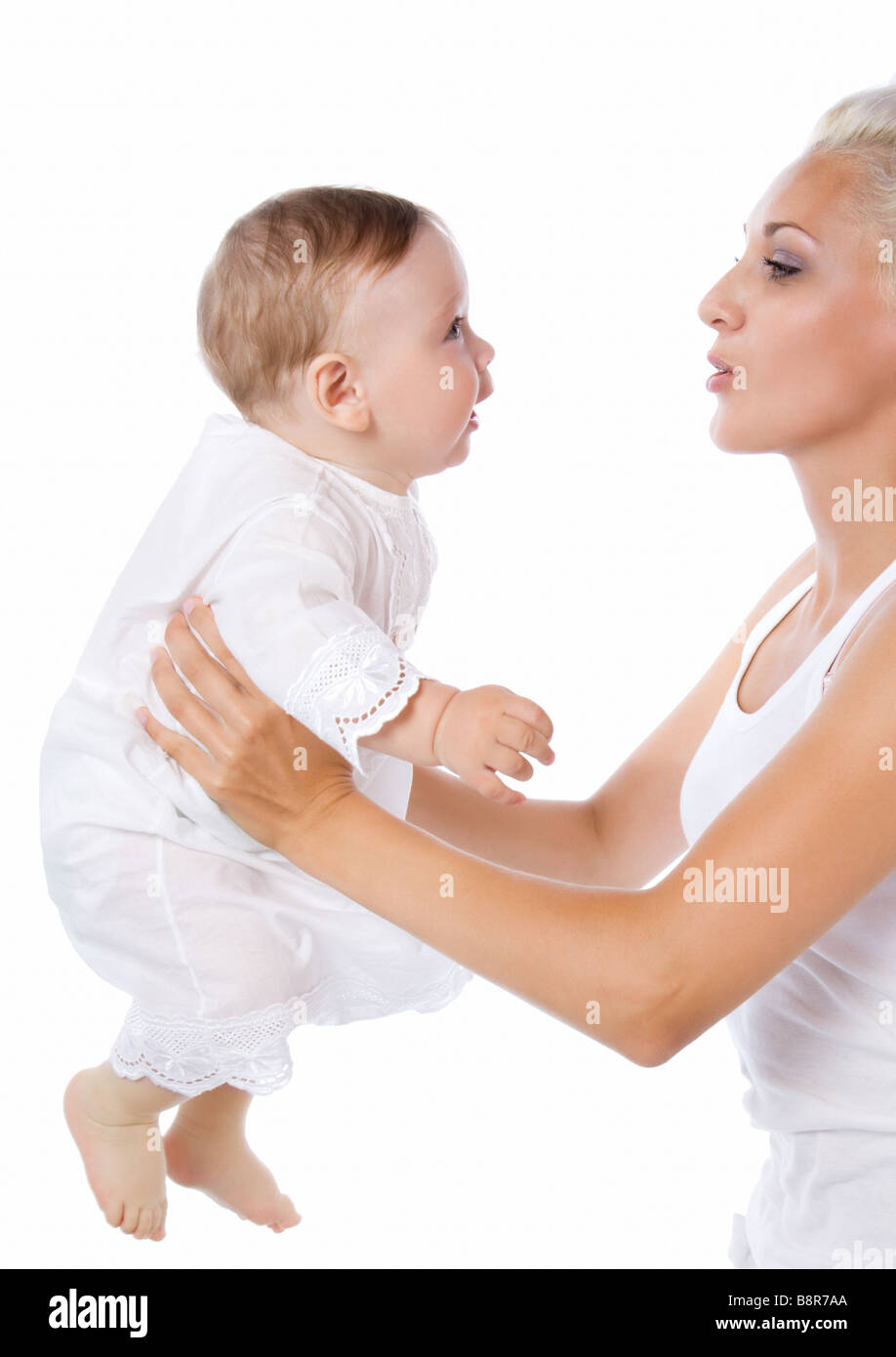 Smiling women with her little child isolated on white Stock Photo - Alamy