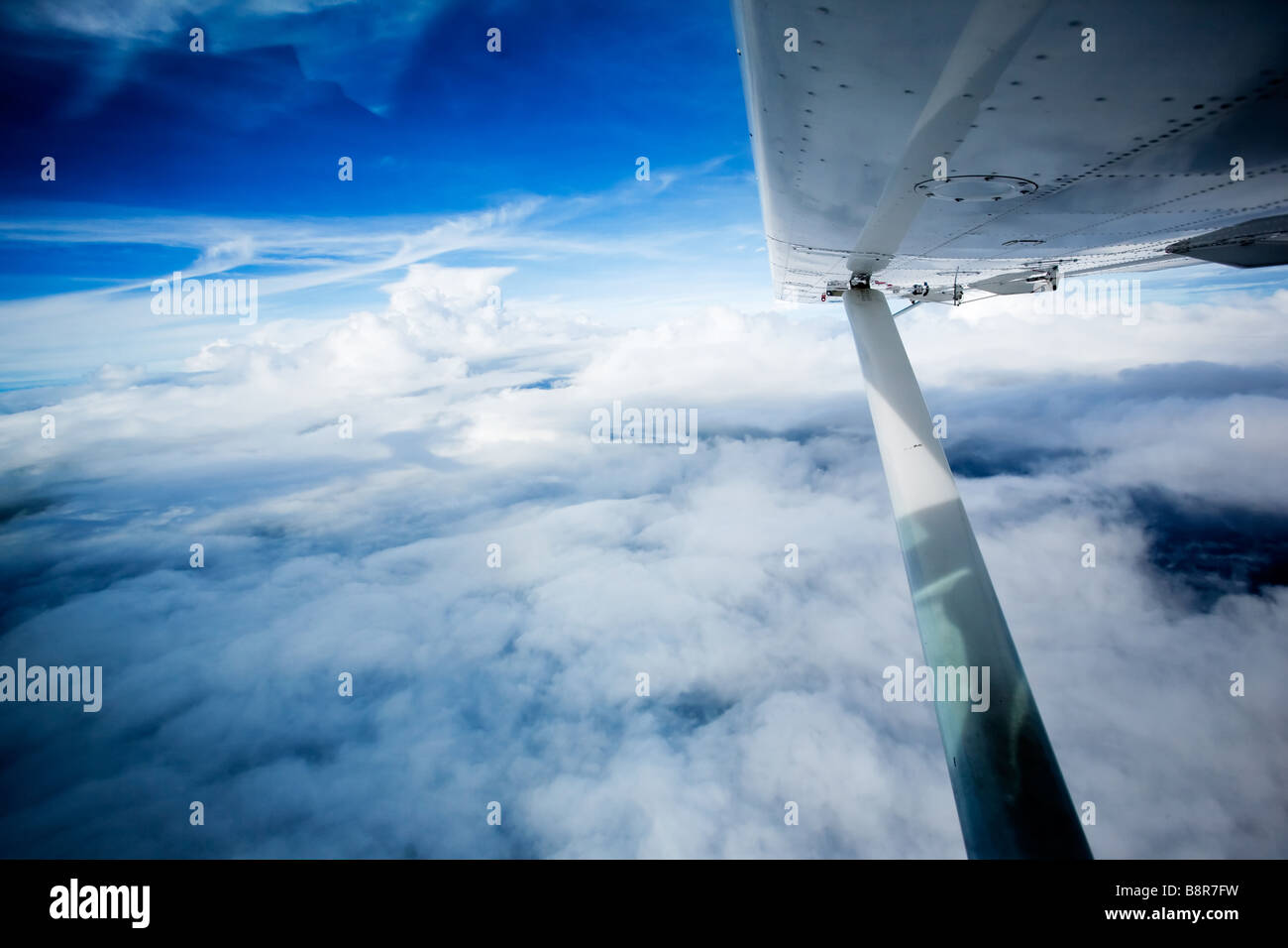 A wing on a small aircraft in flight Stock Photo - Alamy