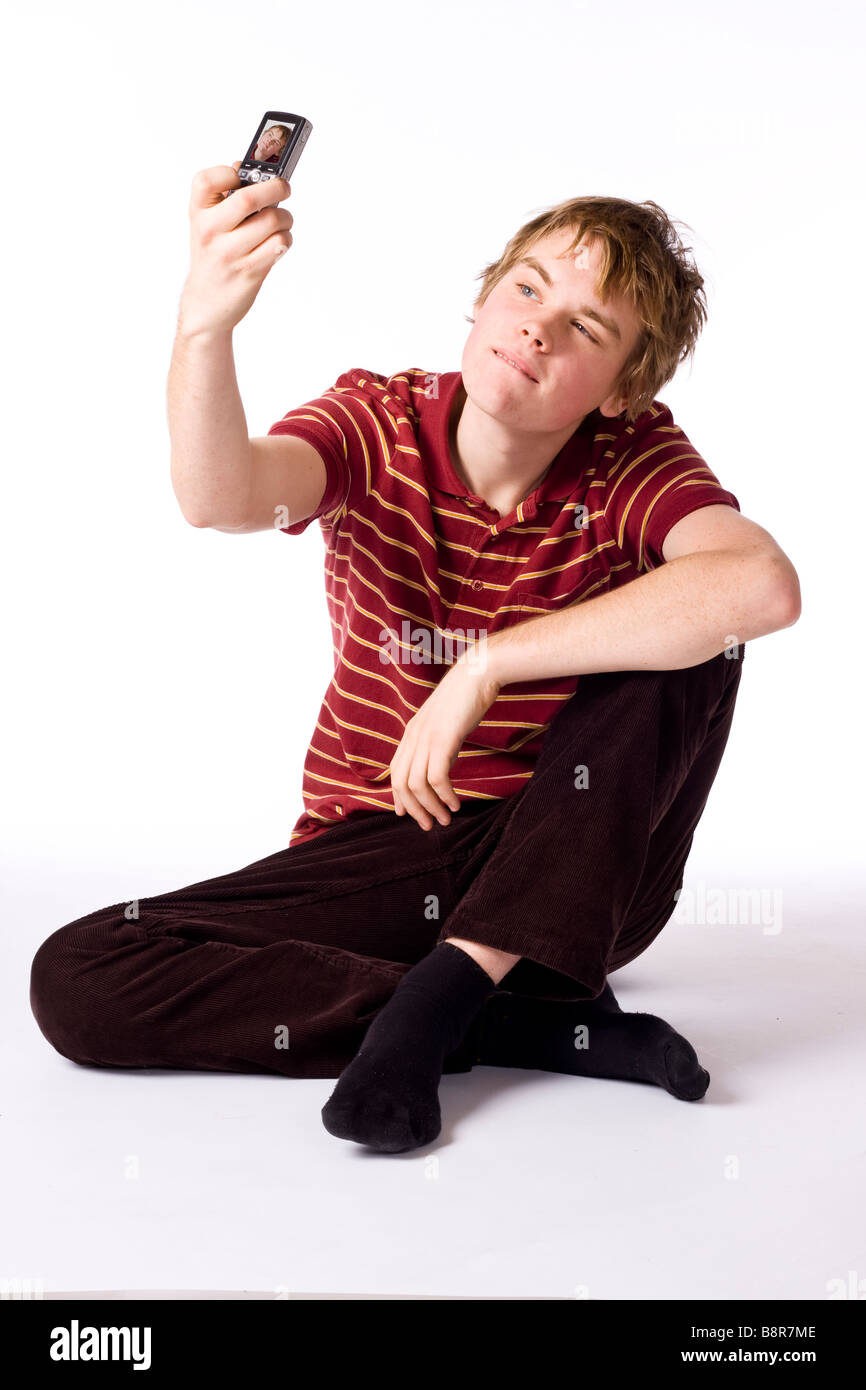 Teenage boy taking his picture with cell phone Stock Photo - Alamy