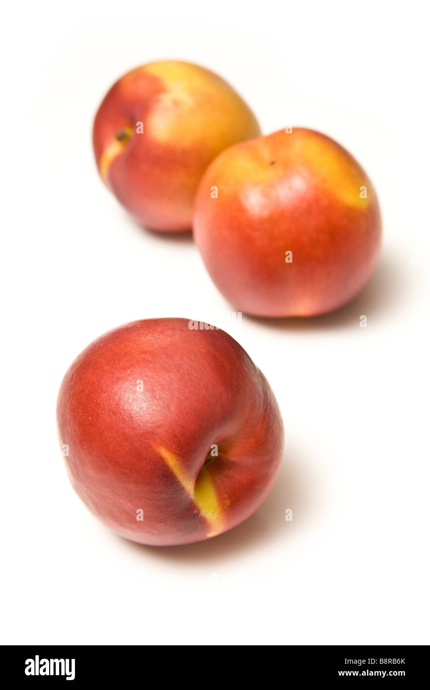 Nectarines isolated on a white studio background Stock Photo - Alamy