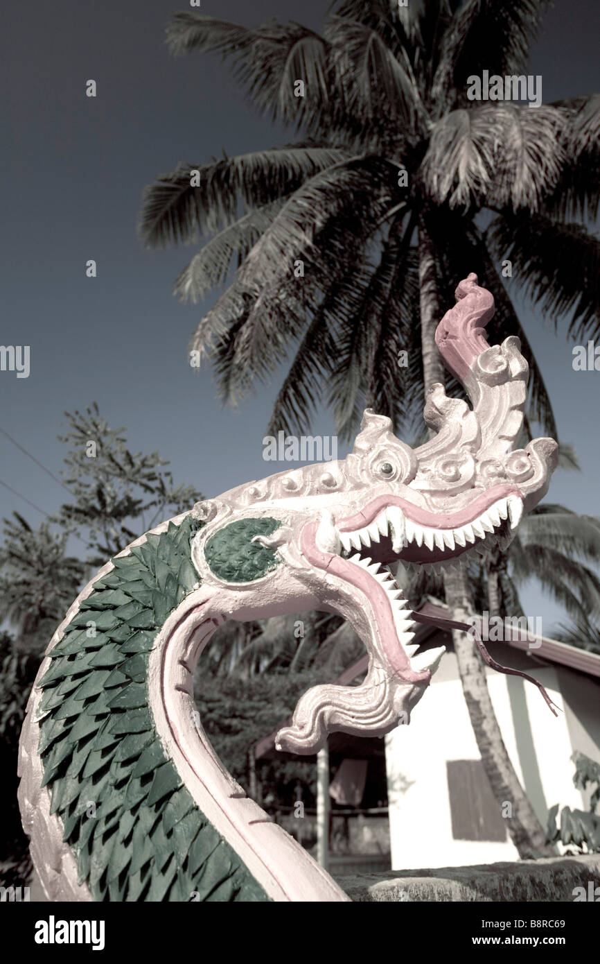Laos, Vientiane Province, Vang Vieng. Temple. Naga. Coconut tree Stock ...