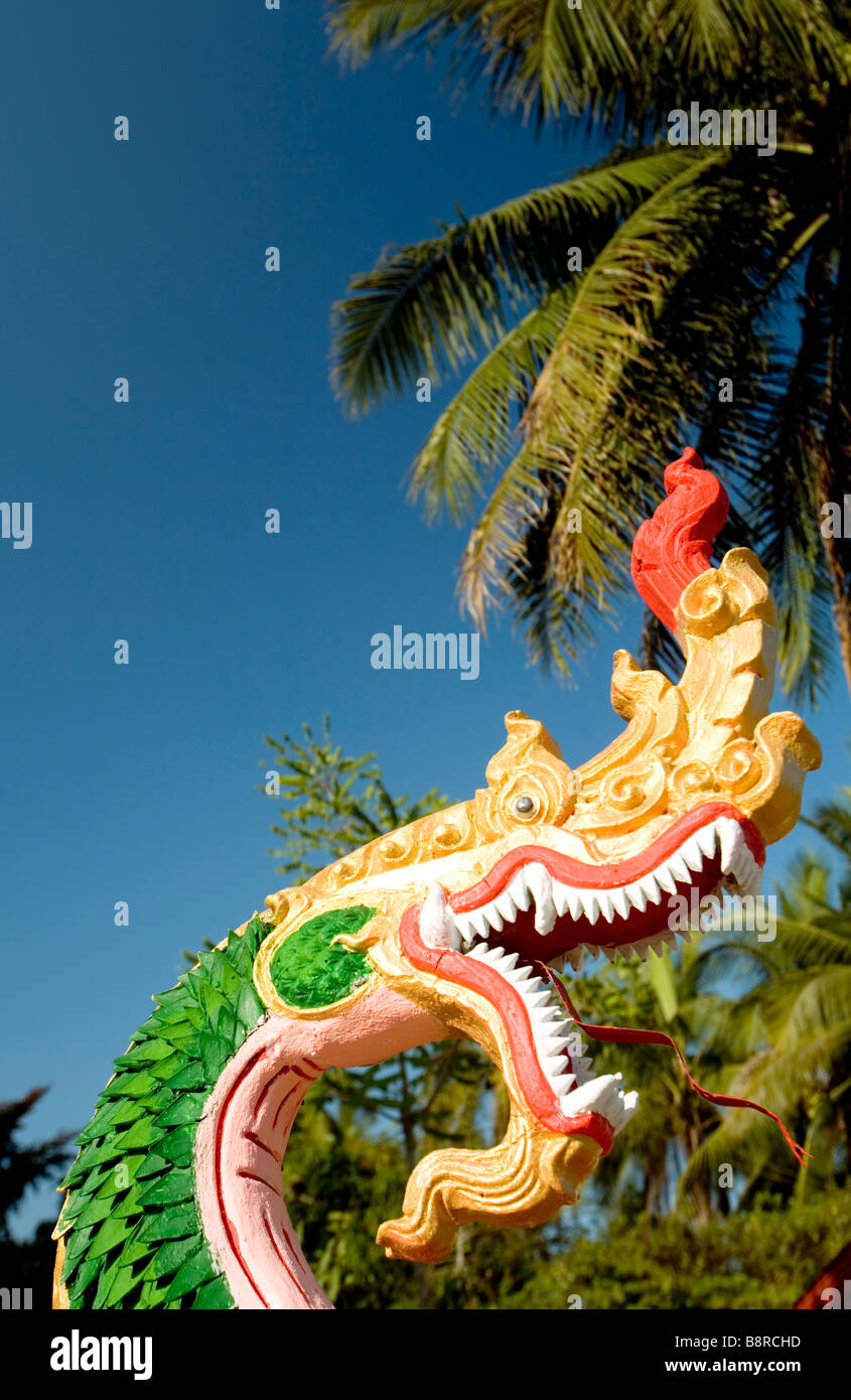 Laos, Vientiane Province, Vang Vieng. Temple. Naga. Coconut tree Stock ...