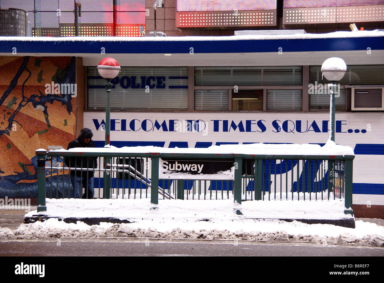 Man enters a subway in front of NYPD office on Times Square Stock Photo ...