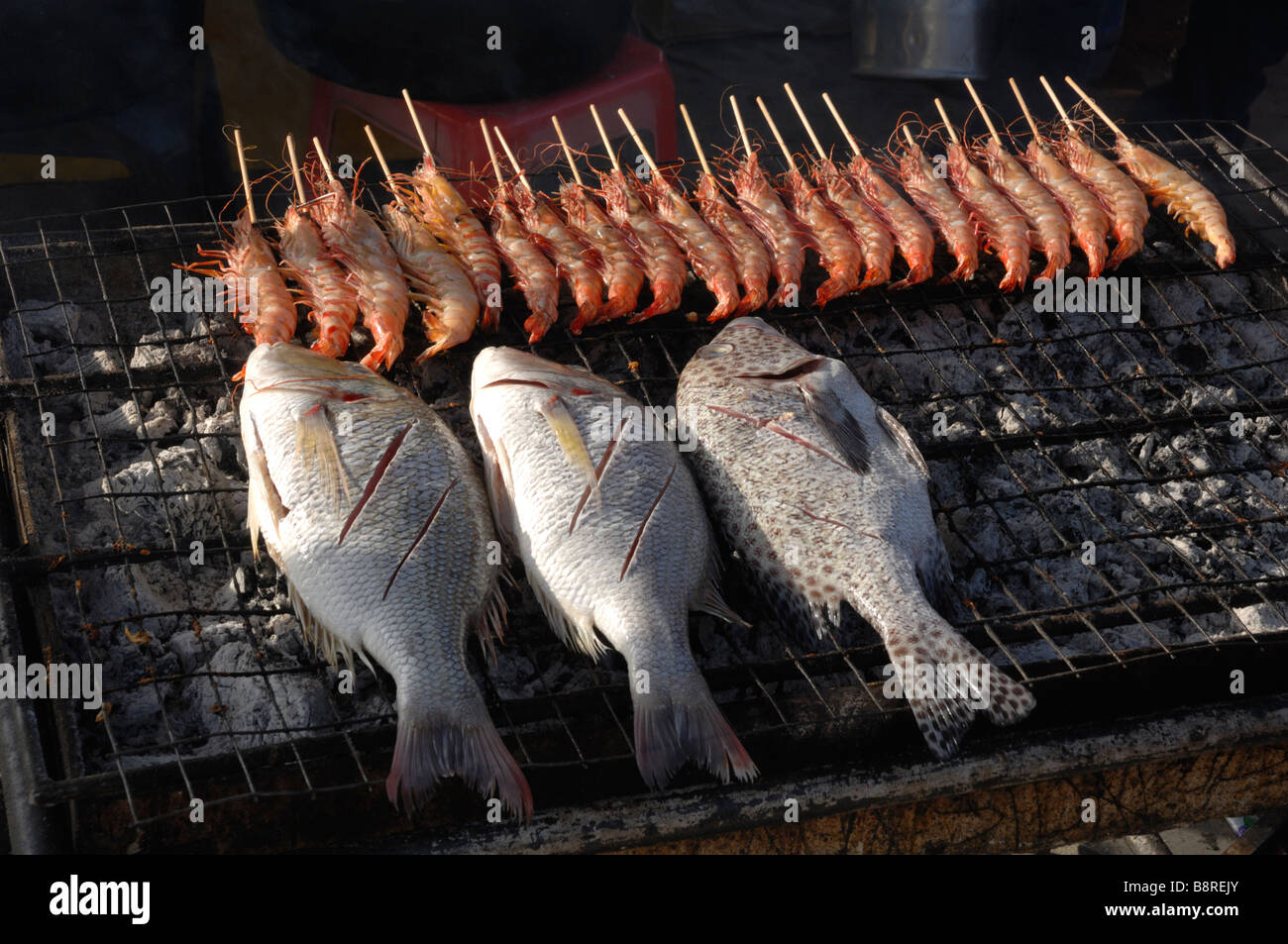 Fish and prawns cooking on barbecue Kota Kinabalu Sabah Malaysia Borneo ...