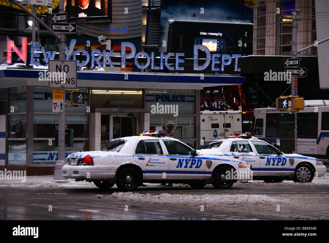 NYPD on Times Square with two police cars Stock Photo - Alamy