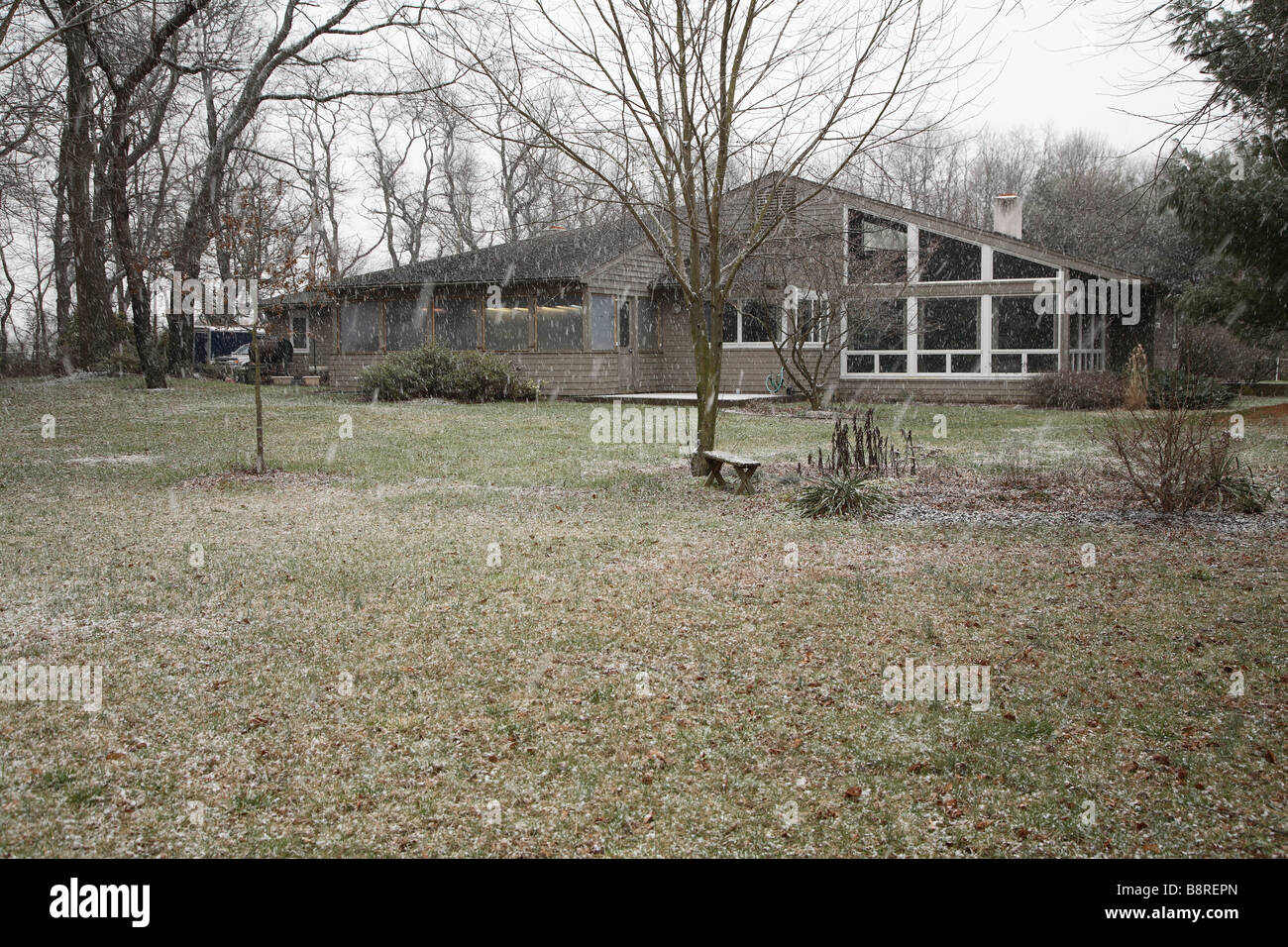 Large contemporary ranch house with big glass windows and large garden ...