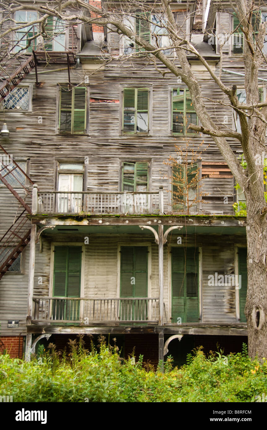 Big old decrepit house with shuttered windows Stock Photo - Alamy