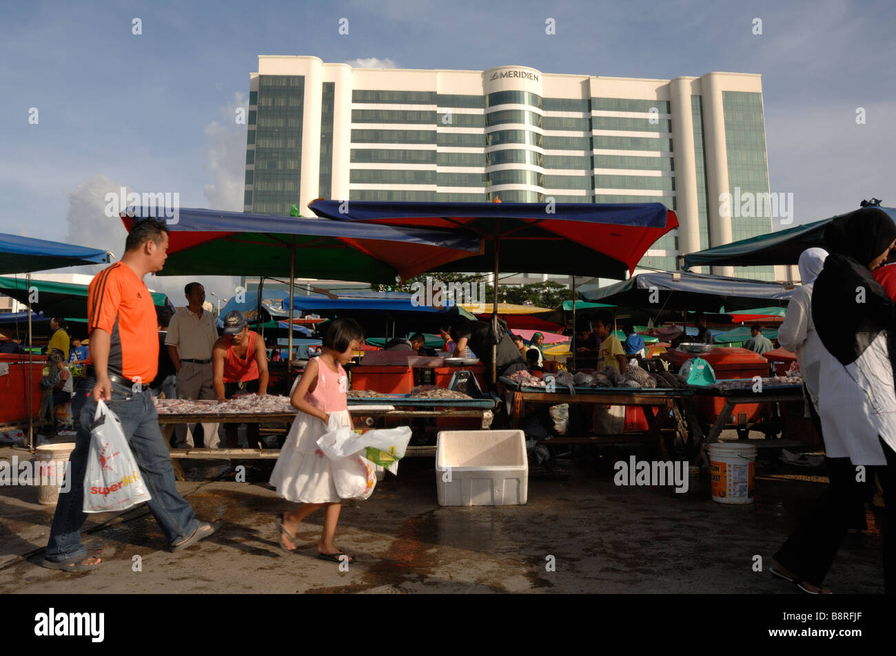 Customers and vendors selling and buying fish fish market waterfront ...