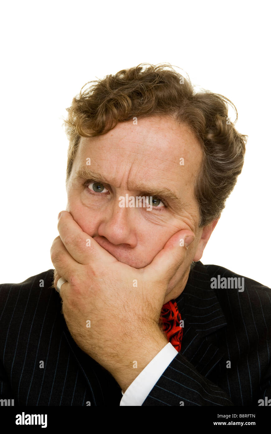 man with hand over mouth Stock Photo - Alamy