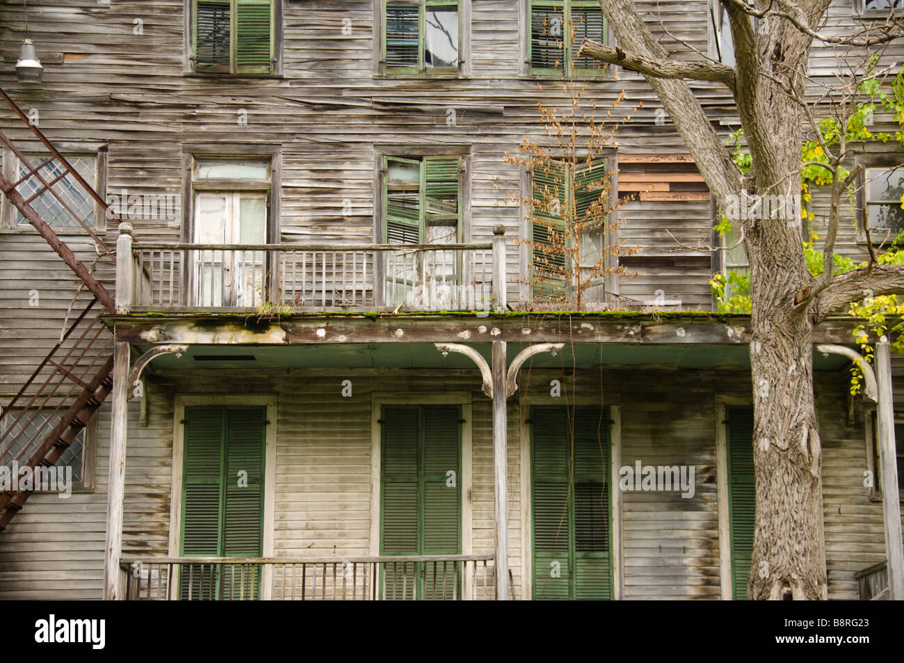 Big old decrepit house with shuttered windows Stock Photo - Alamy