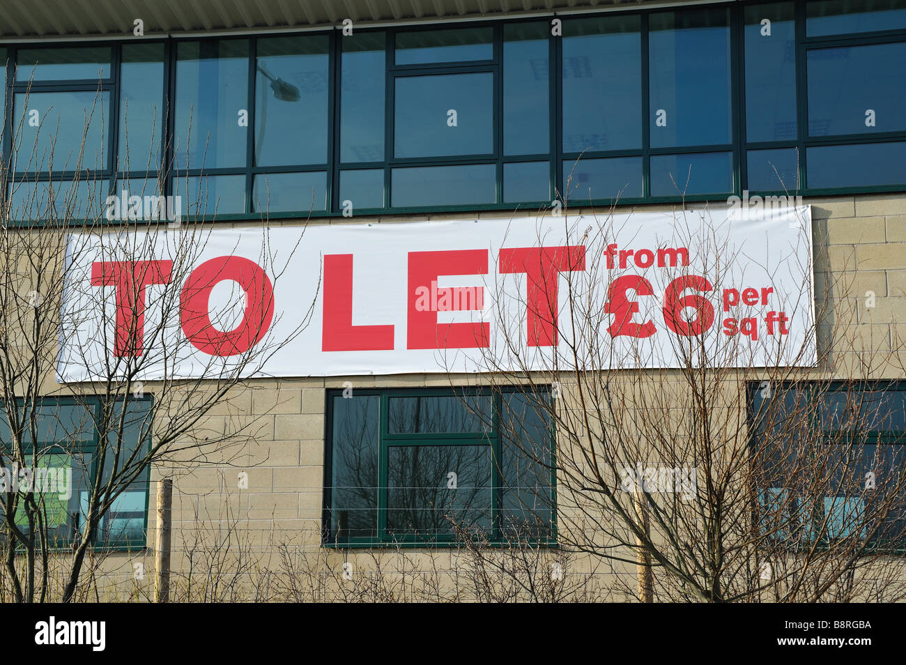 To Let sign on factory Stock Photo - Alamy