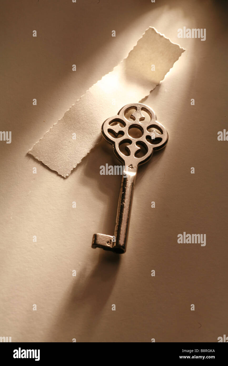 Picture of a symbolic key with notice Stock Photo - Alamy