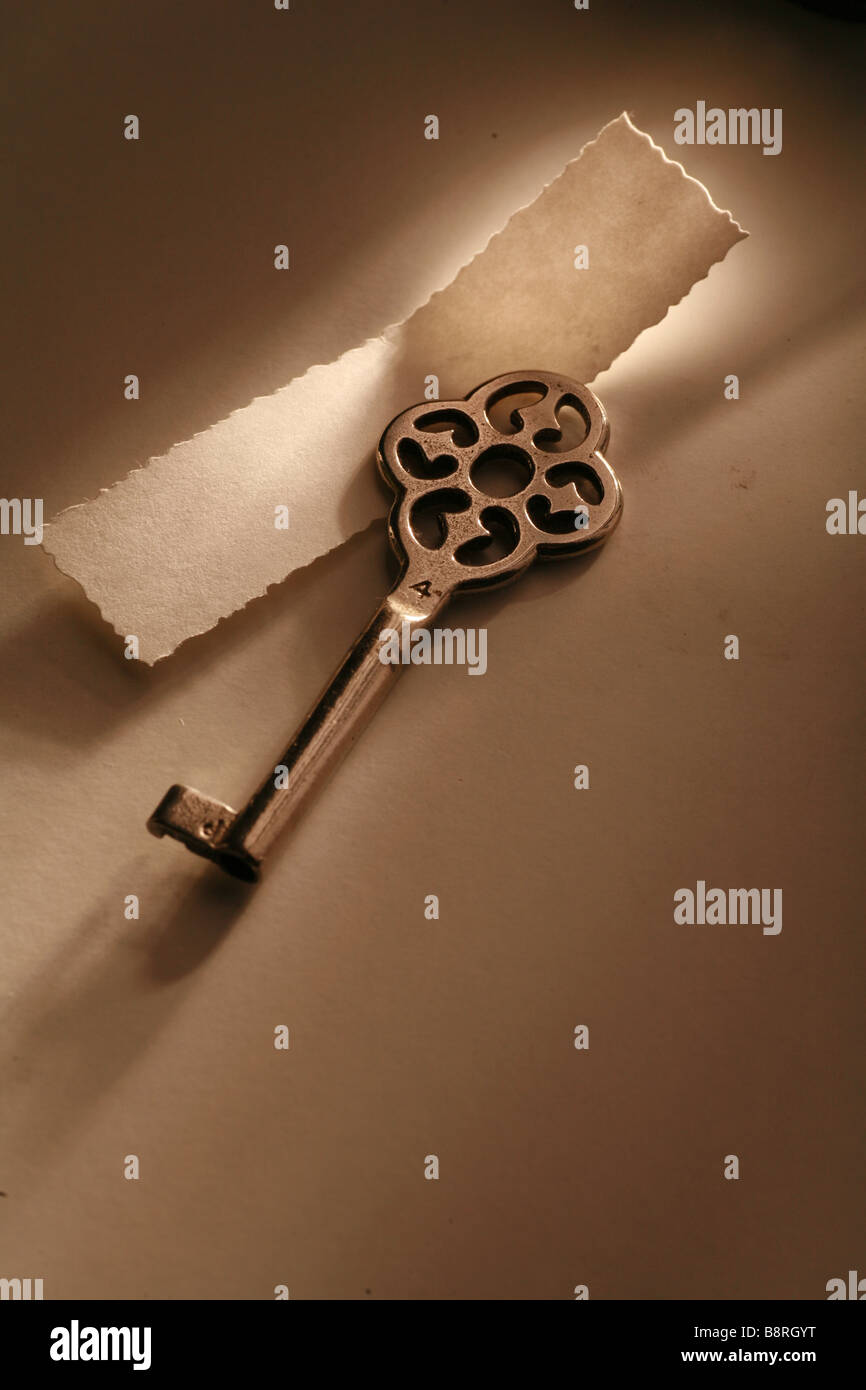 Picture of a symbolic key with notice Stock Photo - Alamy