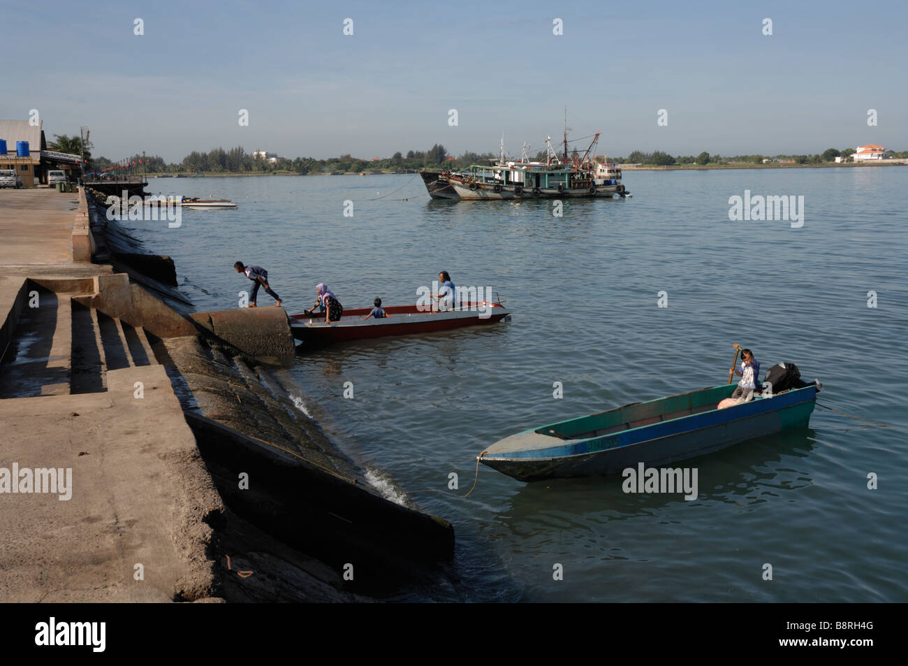 Boats and raw sewage outfall at port Kota Kinabalu Sabah Malyasia ...