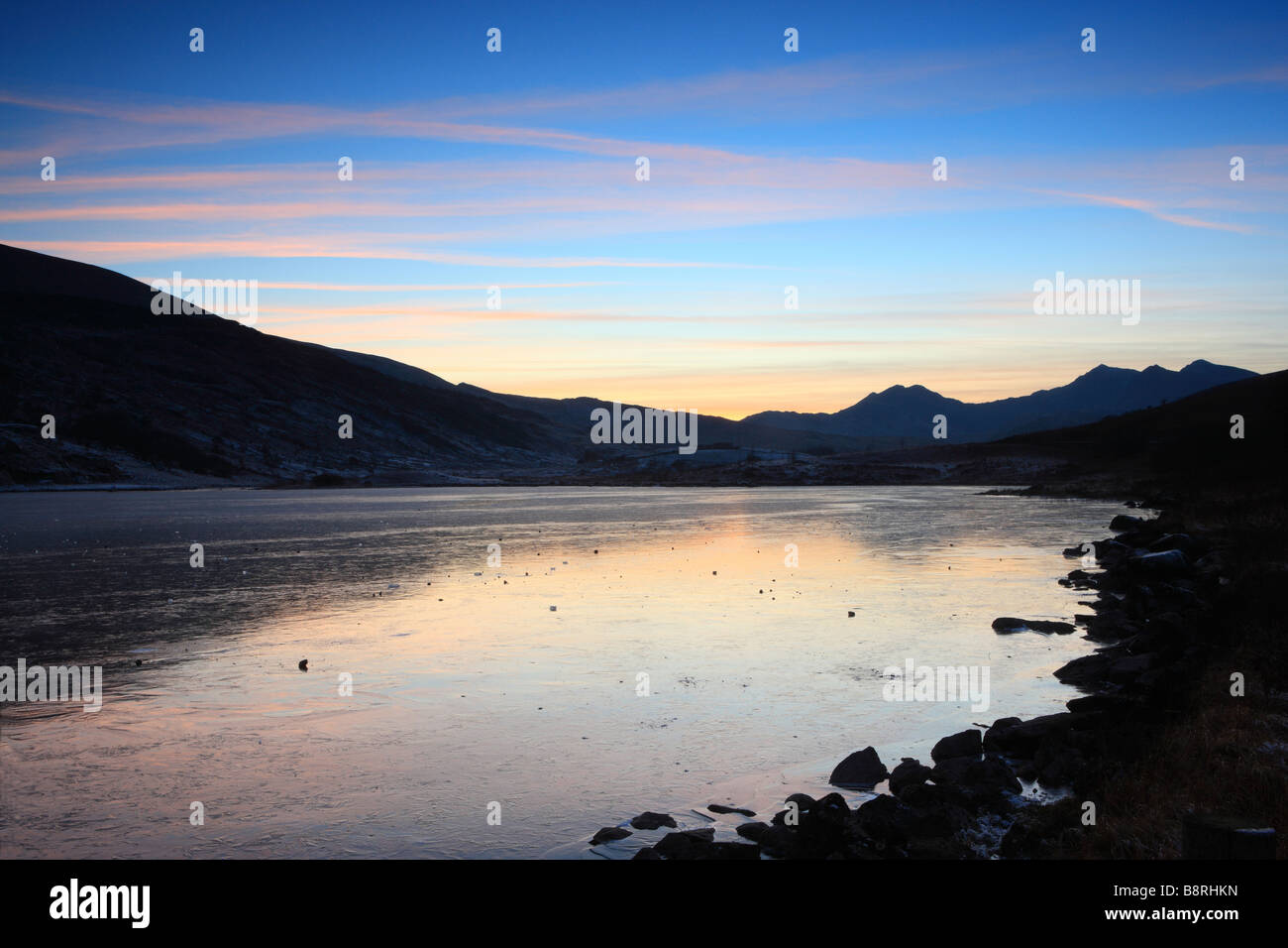 Sunset over the Snowdon range from Llynnau Mymbyr, Capel Curig Stock ...