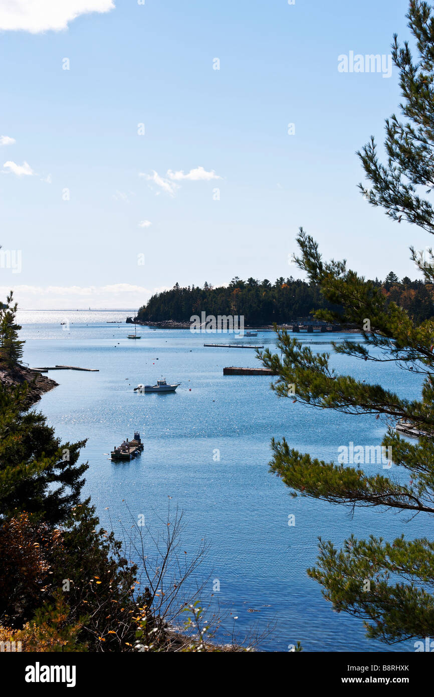 Fishing boats and barge moored in bay Stock Photo - Alamy