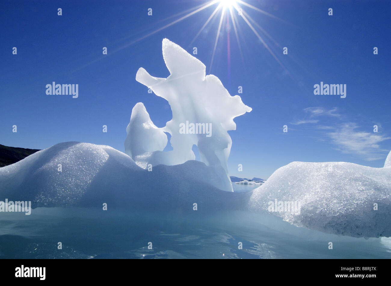 typical landscape - bizarrely shaped ice in backlight, Greenland Stock ...
