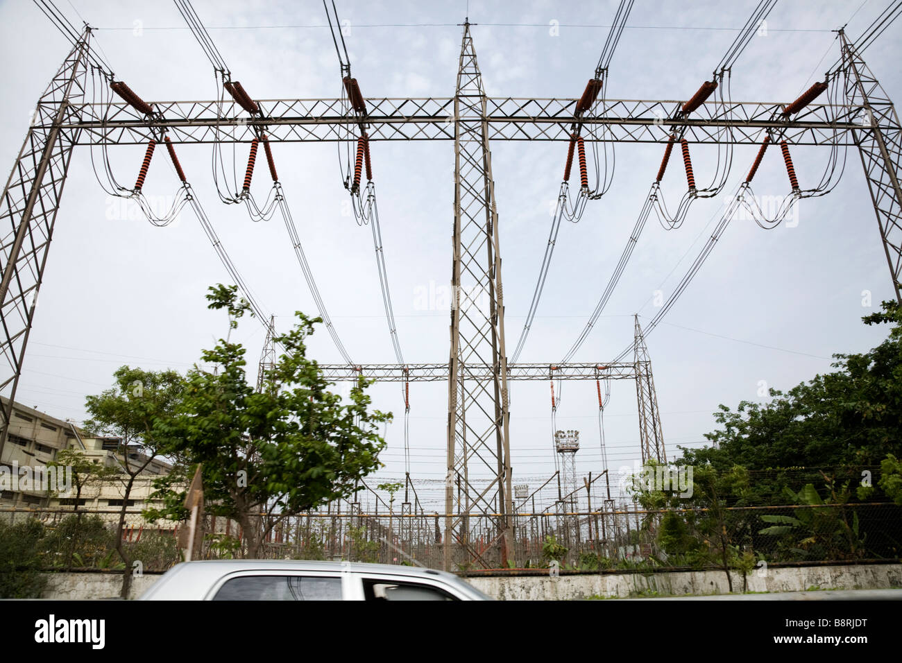 Electrical power lines and pylons in India. Hazira, Surat, Gujarat ...