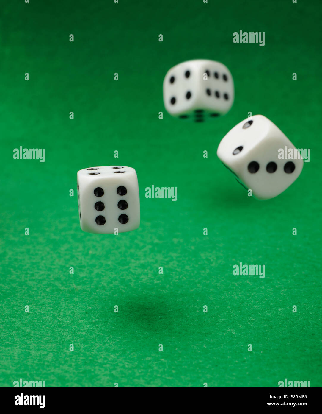 motion dices Game cubes on a green background Stock Photo - Alamy