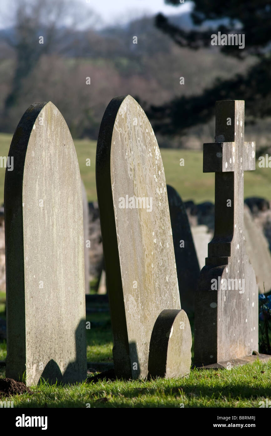 gravestones lit by the sun in a country cemetery Stock Photo - Alamy