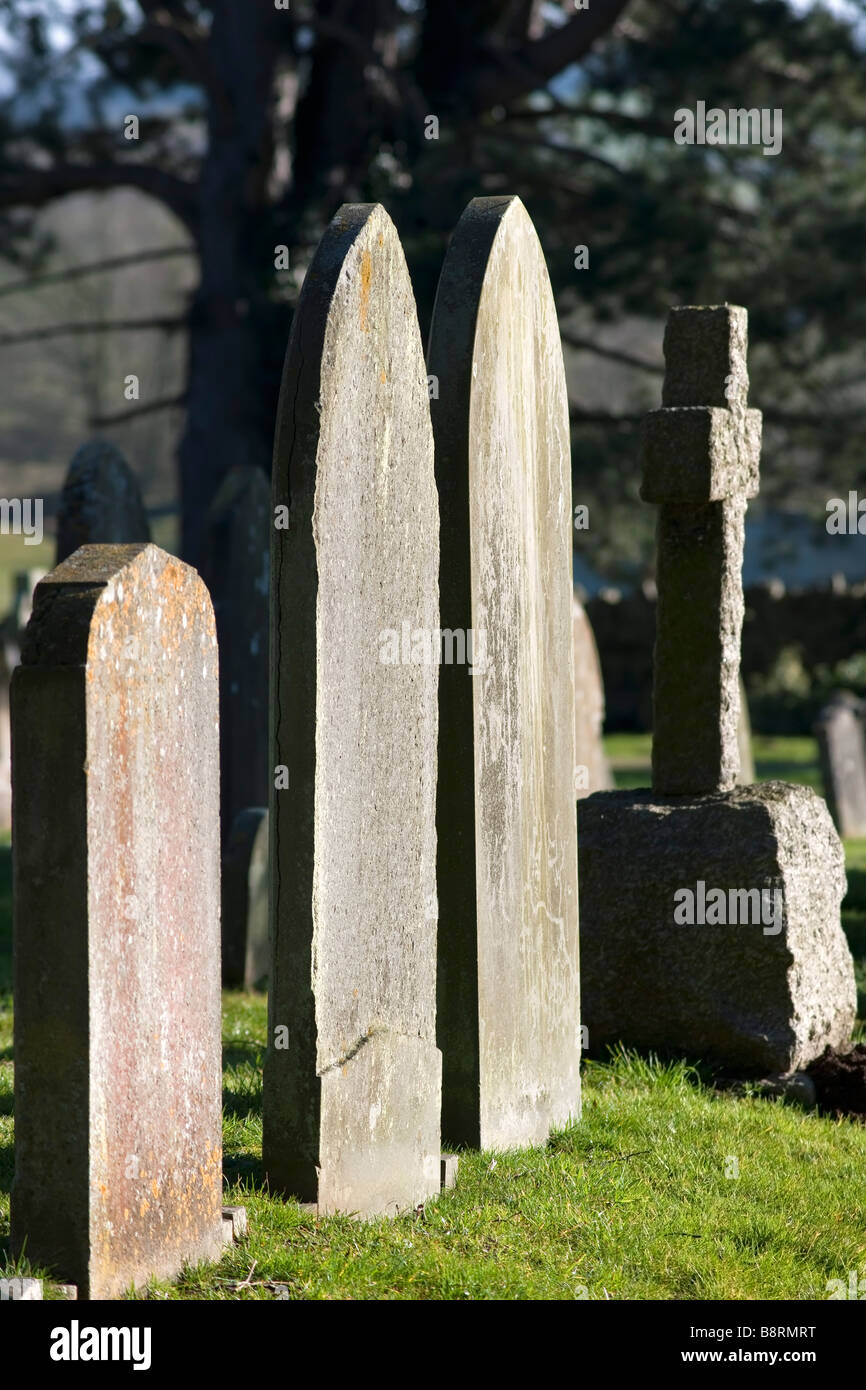 gravestones lit by the sun in a country cemetery Stock Photo - Alamy