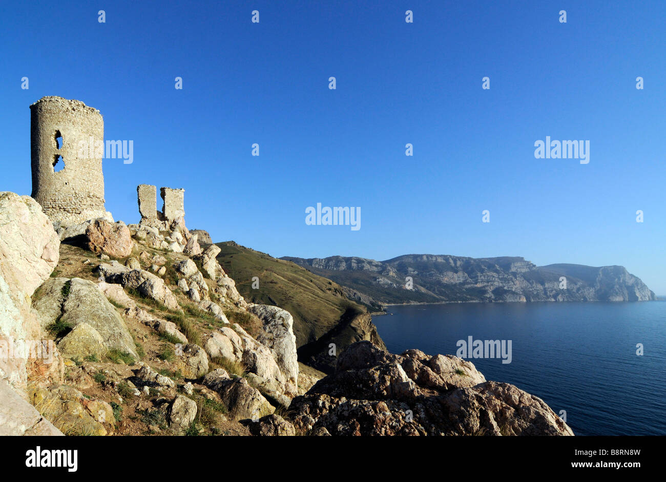 A tower ruins from a medieval Genoese fortress on a clifftop dominating ...