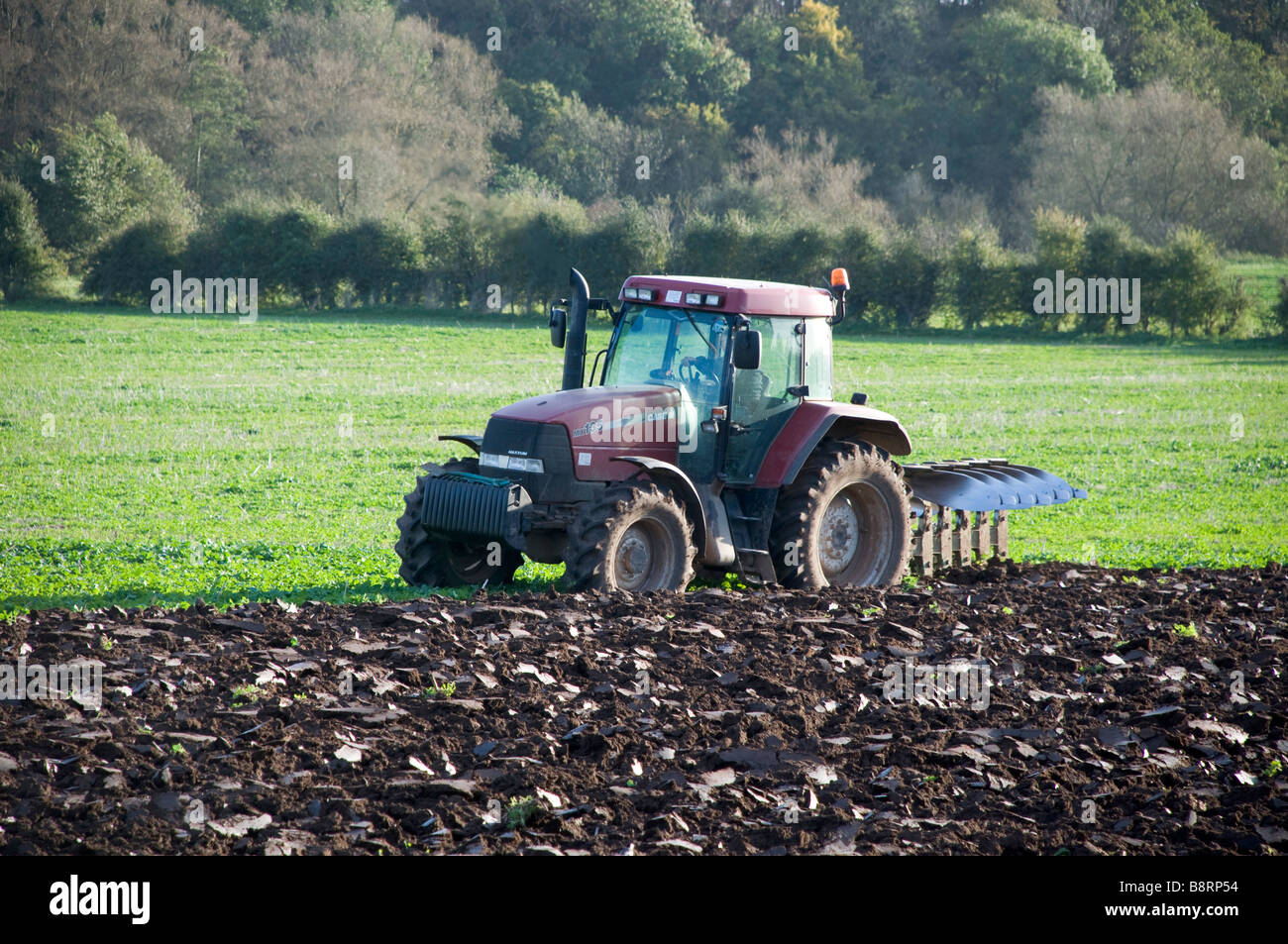 tractor ploughing field Stock Photo - Alamy