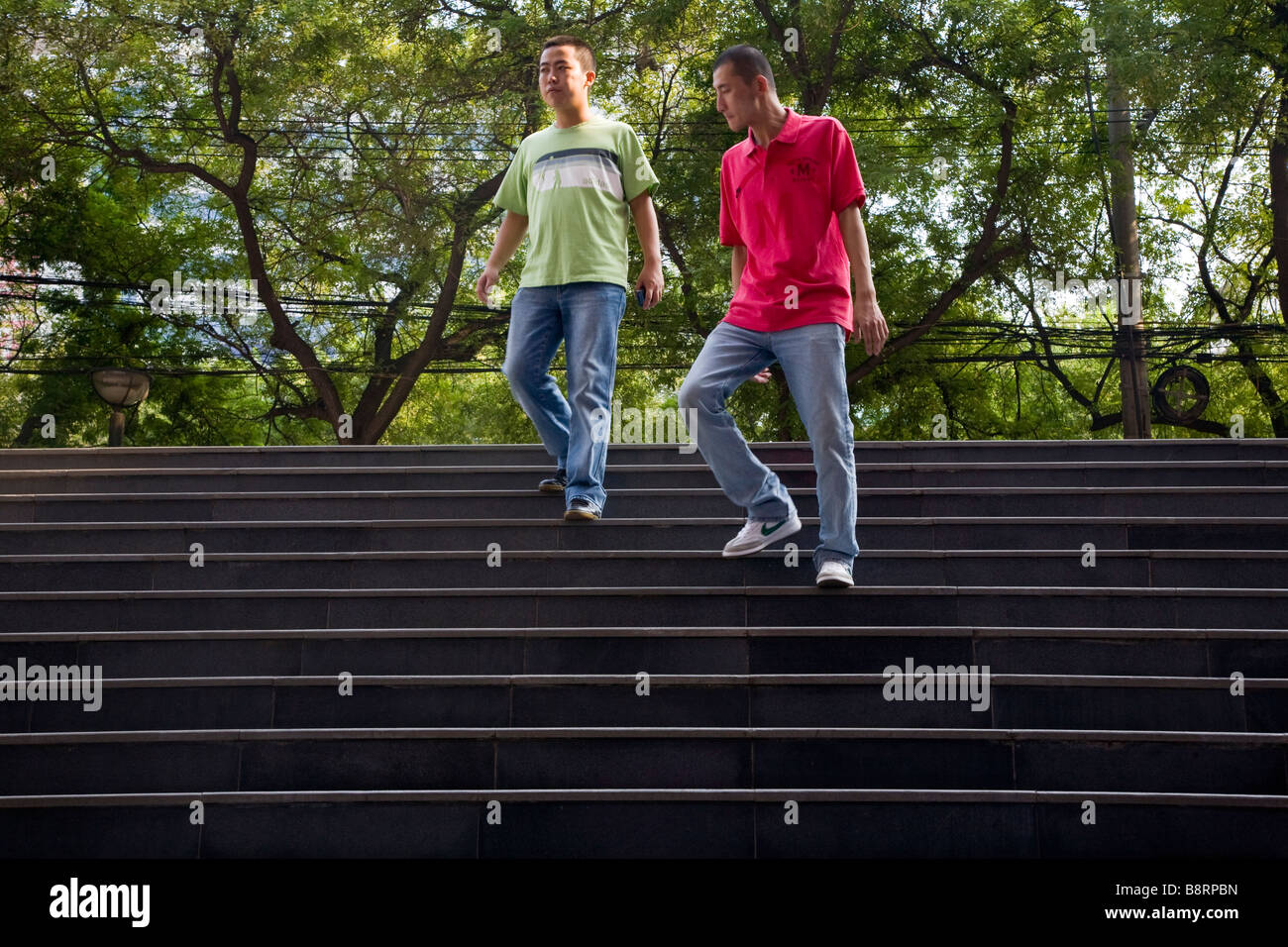 Two young chinese friends hi-res stock photography and images - Alamy