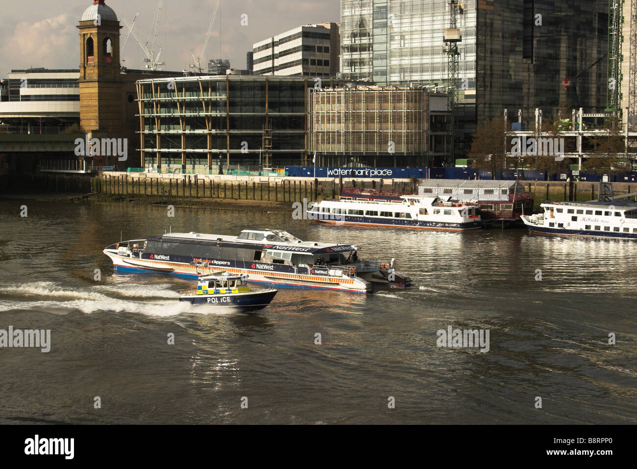 A police launch powers up the River Thames near London Bridge Stock ...