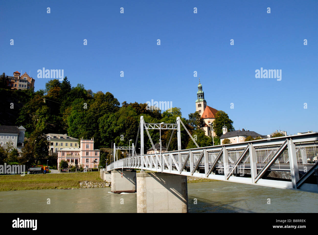 Mullerkirche and footbridge over the Salzbach River in Salzburg in ...