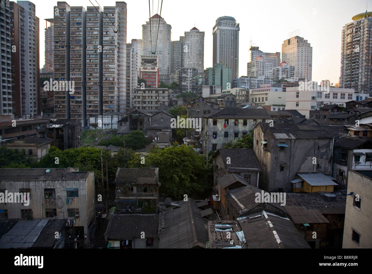 Modern skyscrapers and decayed traditional chinese houses juxtapose ...