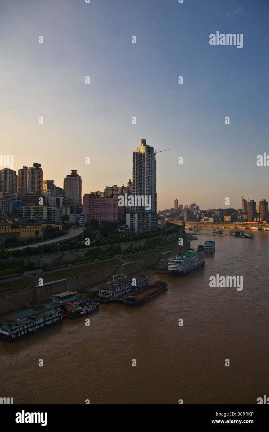 Skyline of central Chongqing peninsula and Yangtze river with boats at ...