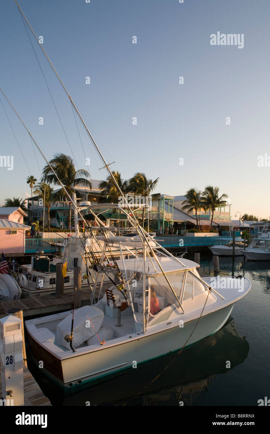 Bahamas Grand Bahama Island Freeport Setting sun lights power boats at ...