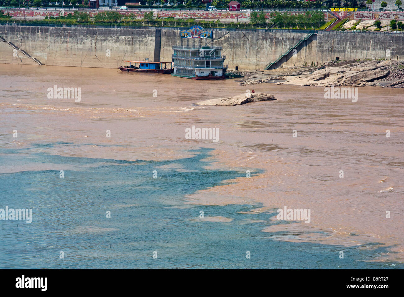 Blue Jialing and red Yangtze rivers meet at the port of Chongqing city ...
