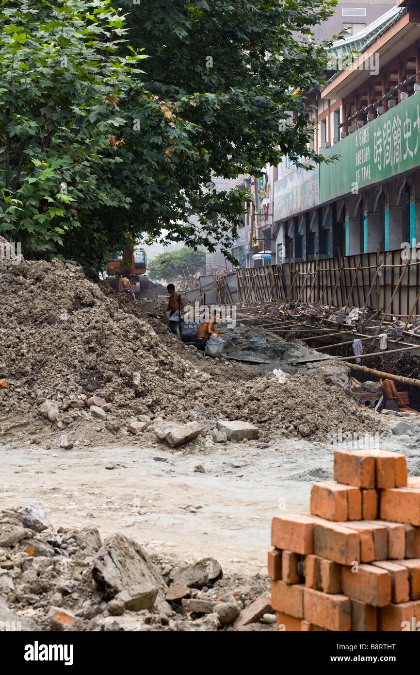 Reparinng underground canalization in a street in Chengdu, Sichuan ...