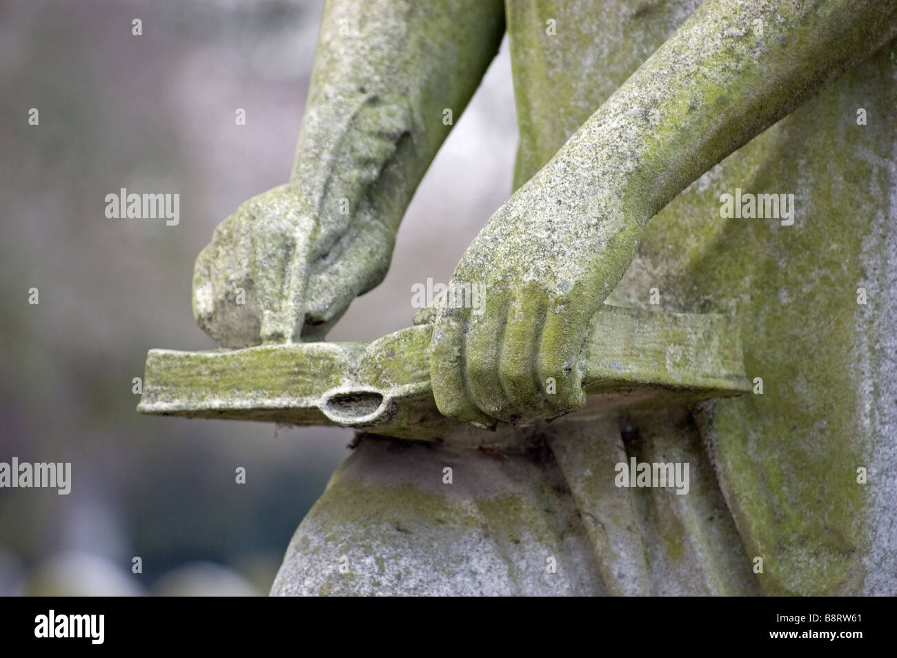Statue of angel writing in graveyard Stock Photo - Alamy