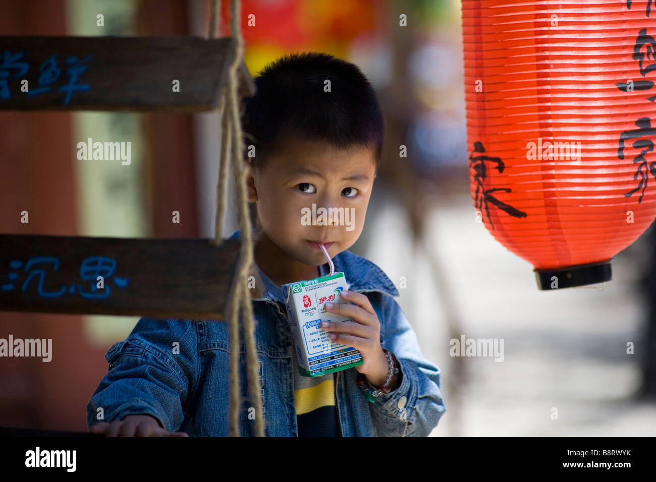 Chinese boy drinking milk in Lijian, Yunnan Province, China Stock Photo ...