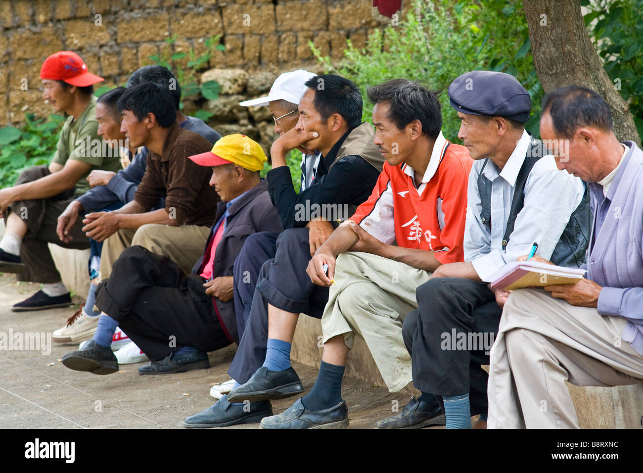 Villagers watch a cricket game in Baisha, Yunnan Province, China Stock ...